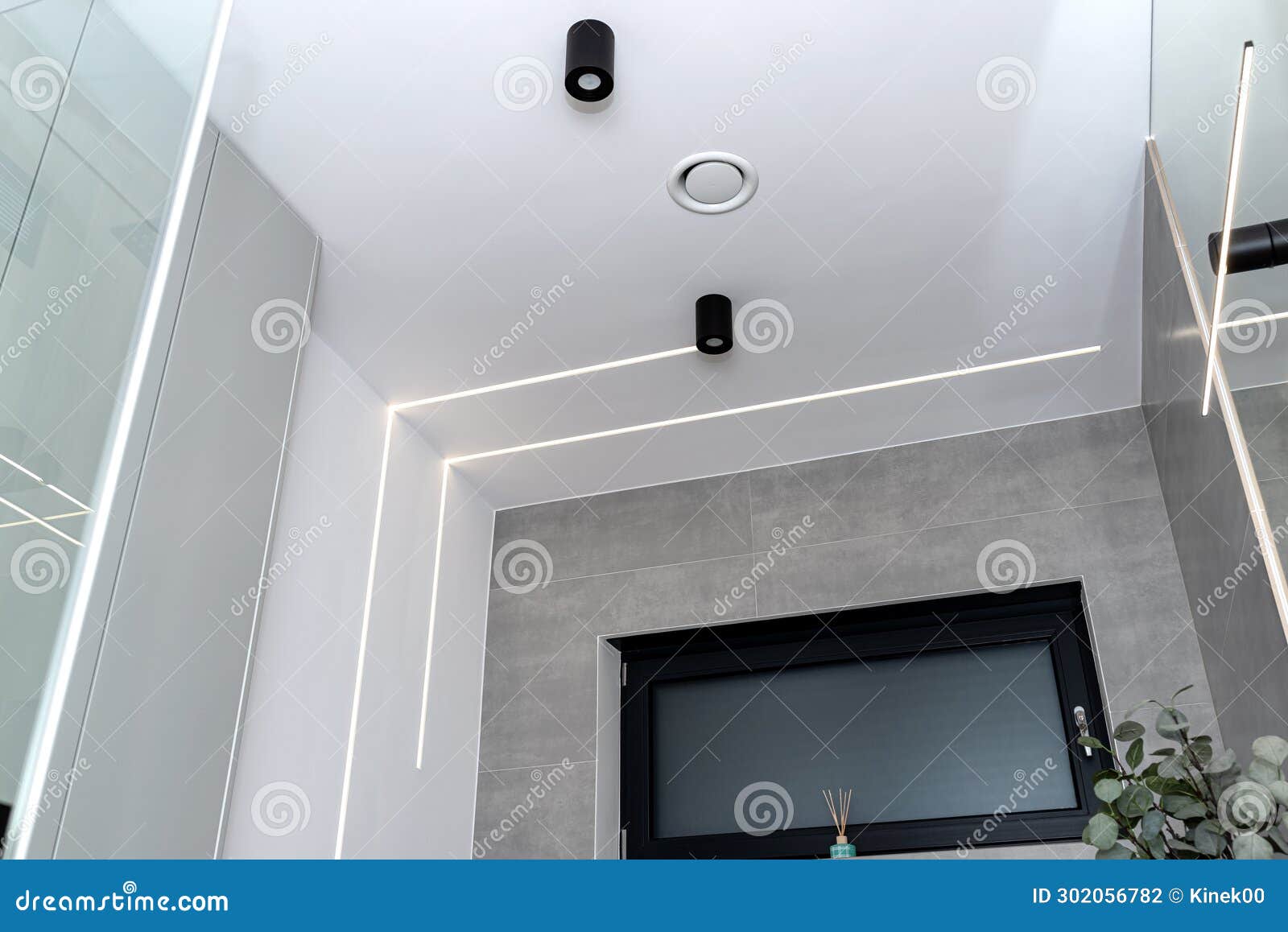 LED Light Strips Mounted in the Wall and Ceiling in a Modern Bathroom ...