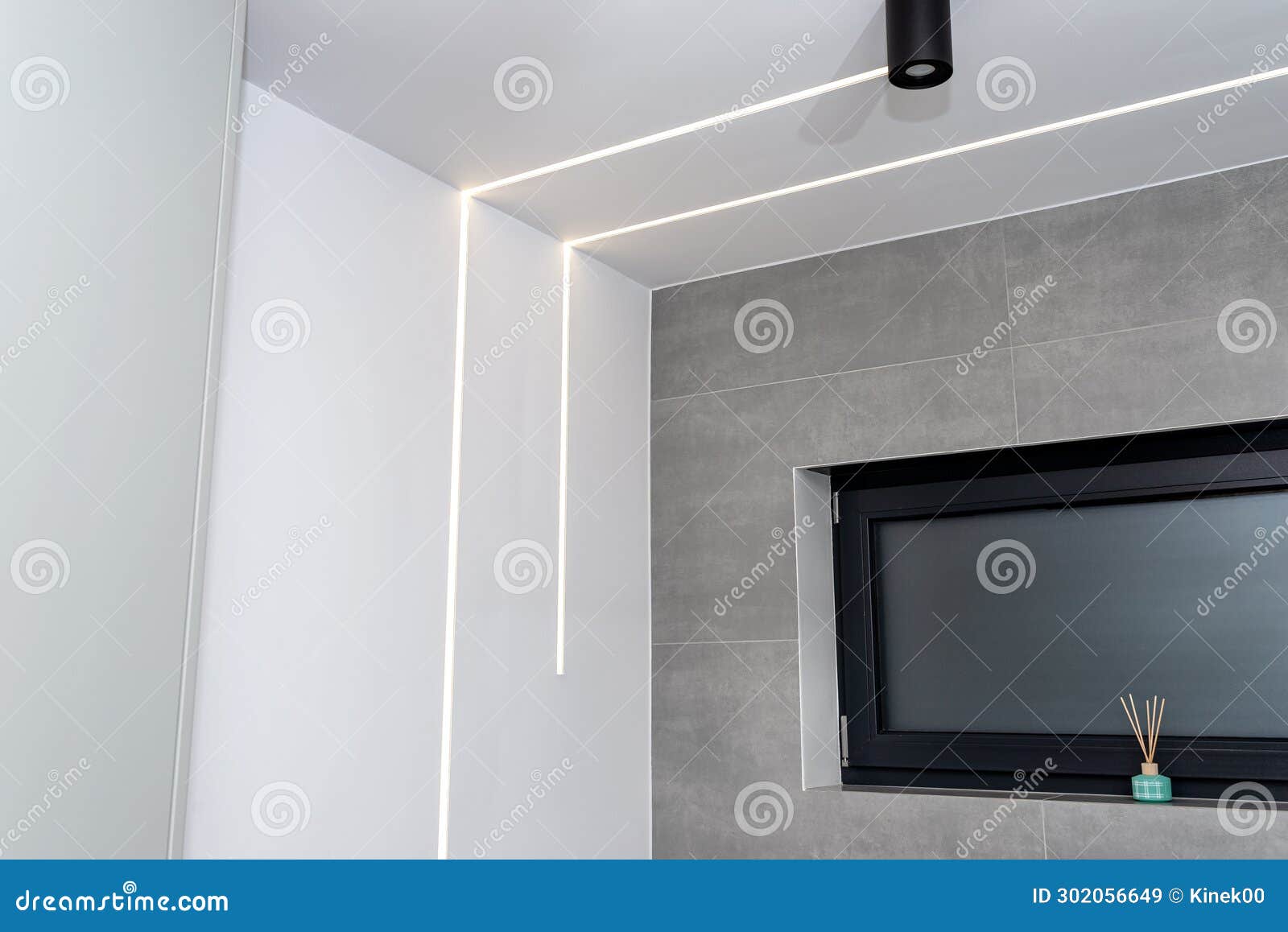 LED Light Strips Mounted in the Wall and Ceiling in a Modern Bathroom ...