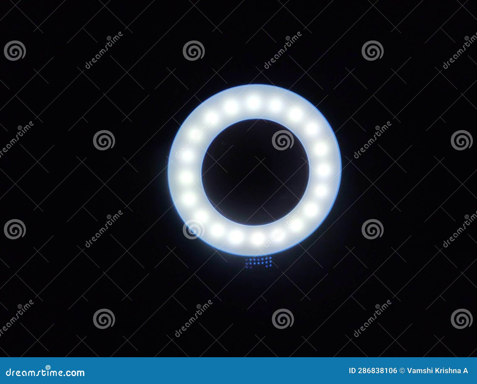 A Circular LED Ring Light Glows Softly Against a Dark Background Stock ...