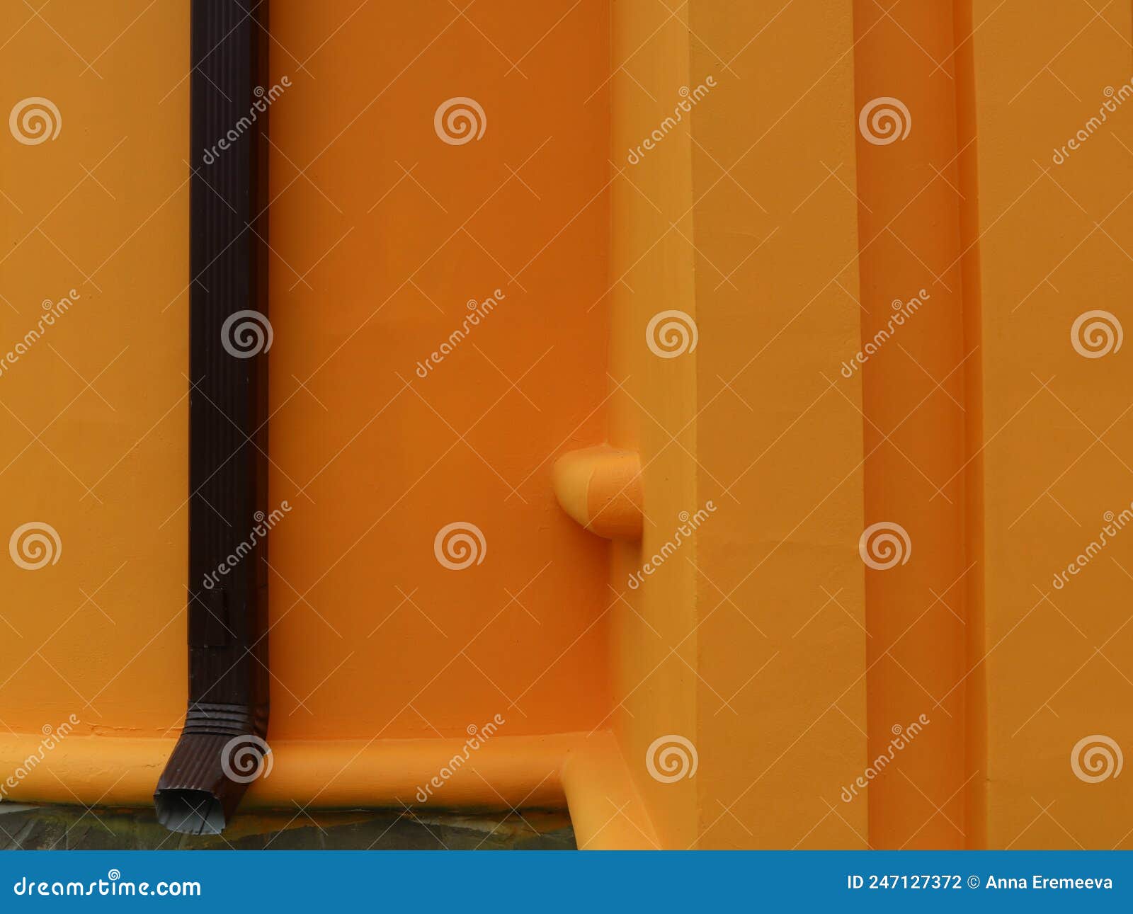 Ledge of an Urban Orange Building with a Drainage System Stock Photo ...