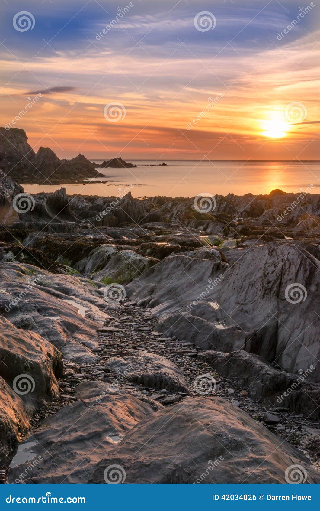 Lee Bay sunset stock photo. Image of ocean, england, clover - 42034026