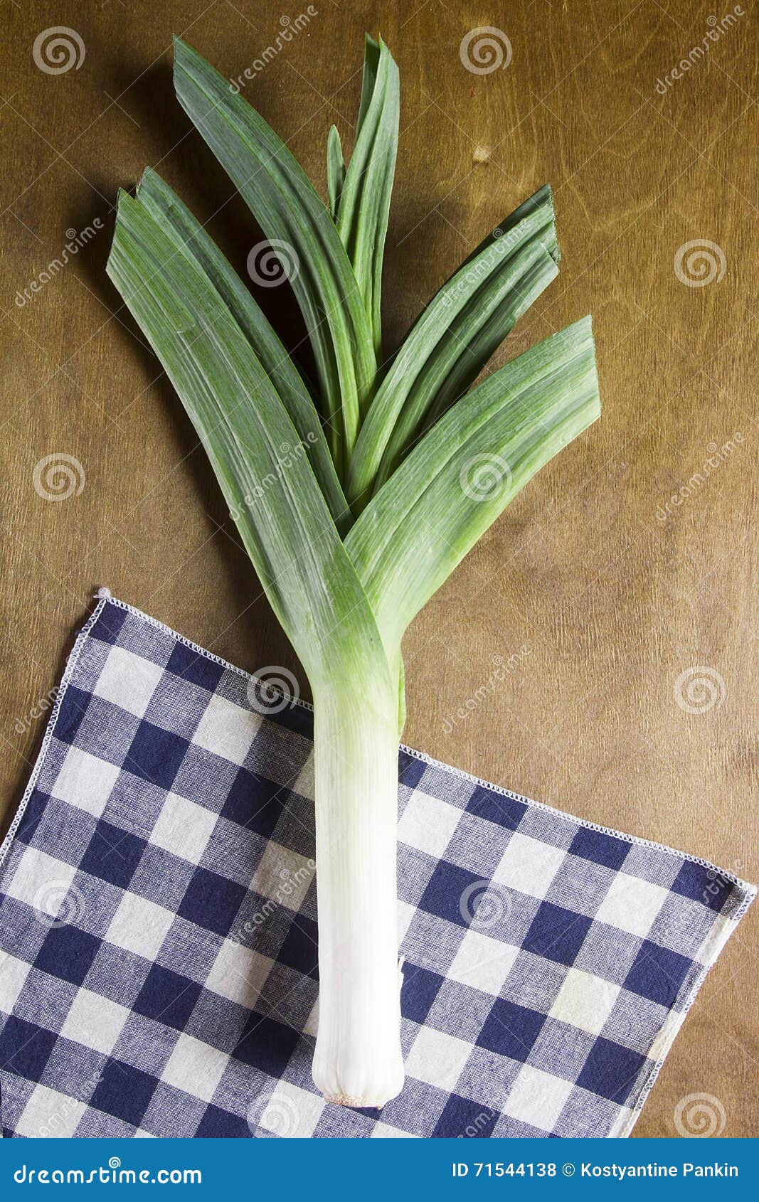Leek on a wooden wall stock photo. Image of bunch, market - 71544138