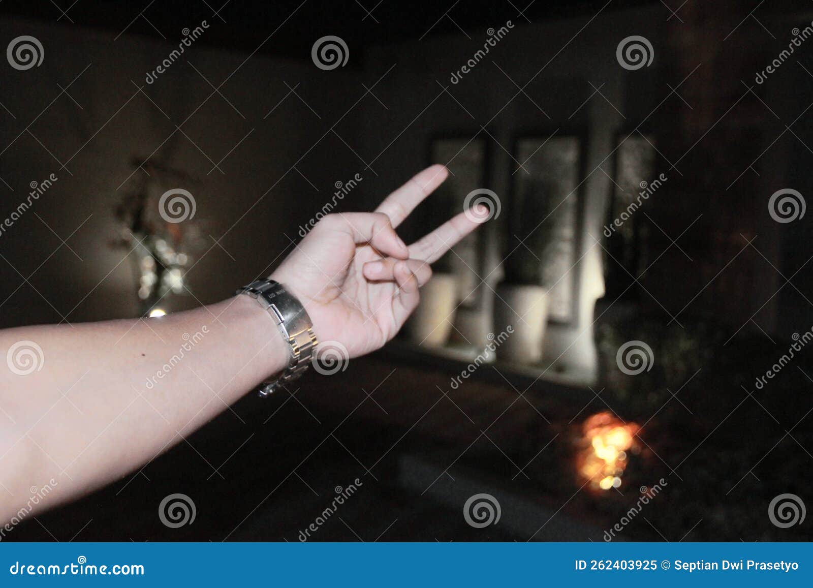 The Left Hand Who Wears a Watch with the Pose of Peace Stock Image ...
