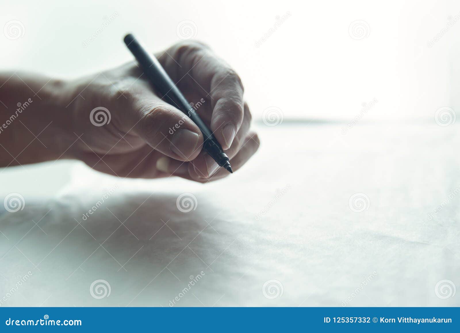 Left hand writing closeup stock photo. Image of gray - 125357332
