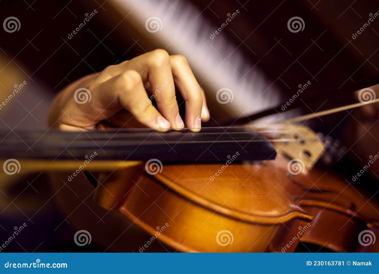 Left Hand of a Young Violinist Presses the Strings on the Violin Neck ...