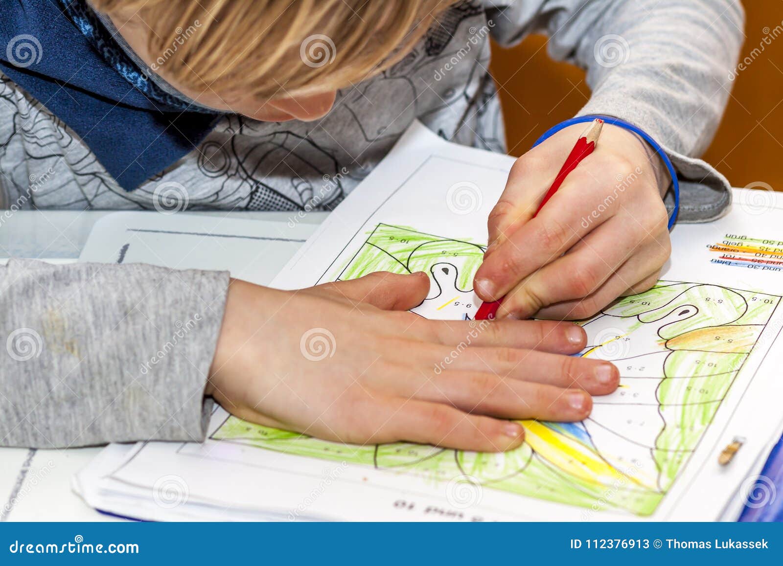 Left Handed Young Boy Working on His Homework Stock Image - Image of ...