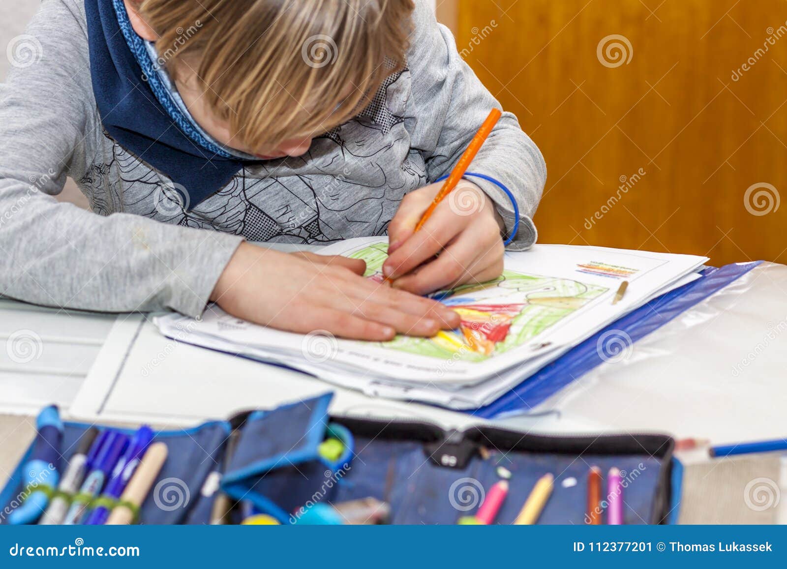 Left Handed Young Boy Working on His Homework Stock Image - Image of ...