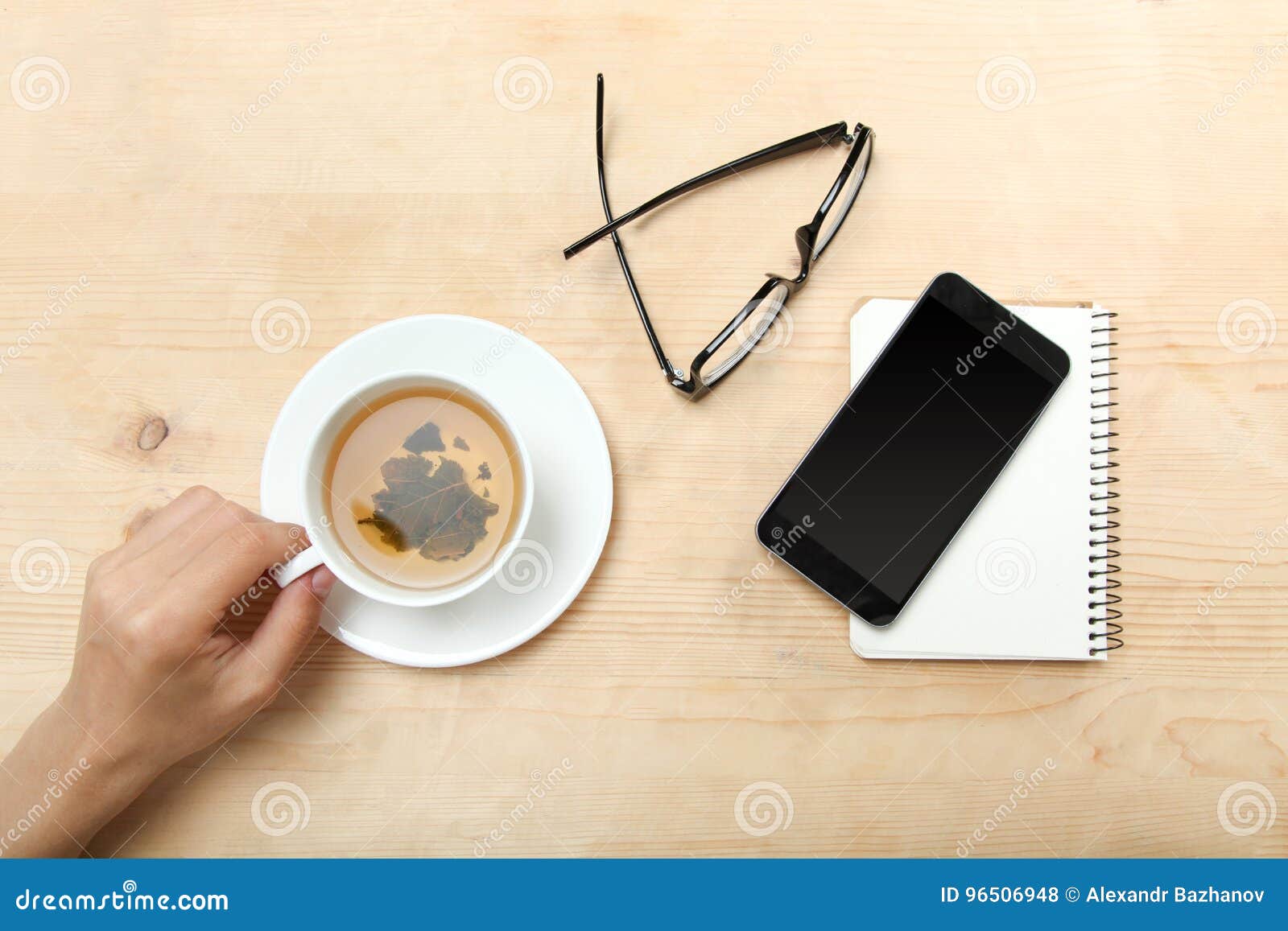 A left-hander holds a cup stock photo. Image of flat - 96506948