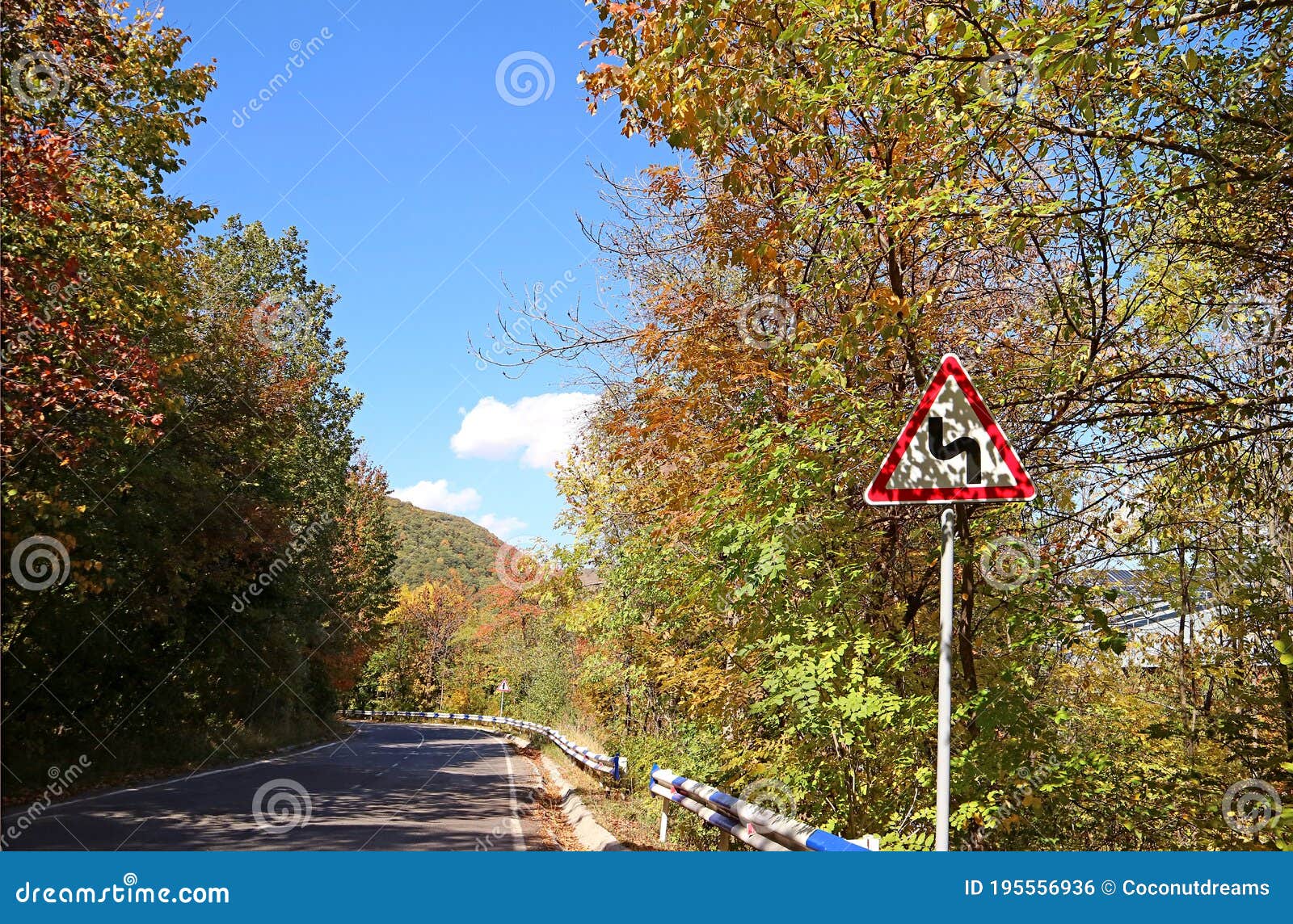 Left Reverse Bend Road Sign on the Windy Mountain Road among Fall ...