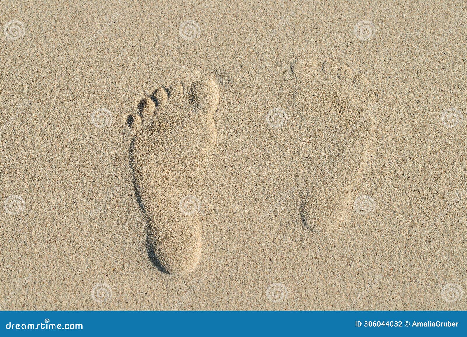 Left and Right Human Footprints in Light, Yellow Sand. Stock Photo ...