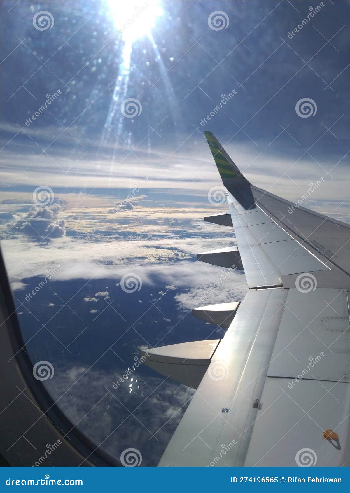The Left Wing Of A Flying Plane From The Window Above The Clouds ...
