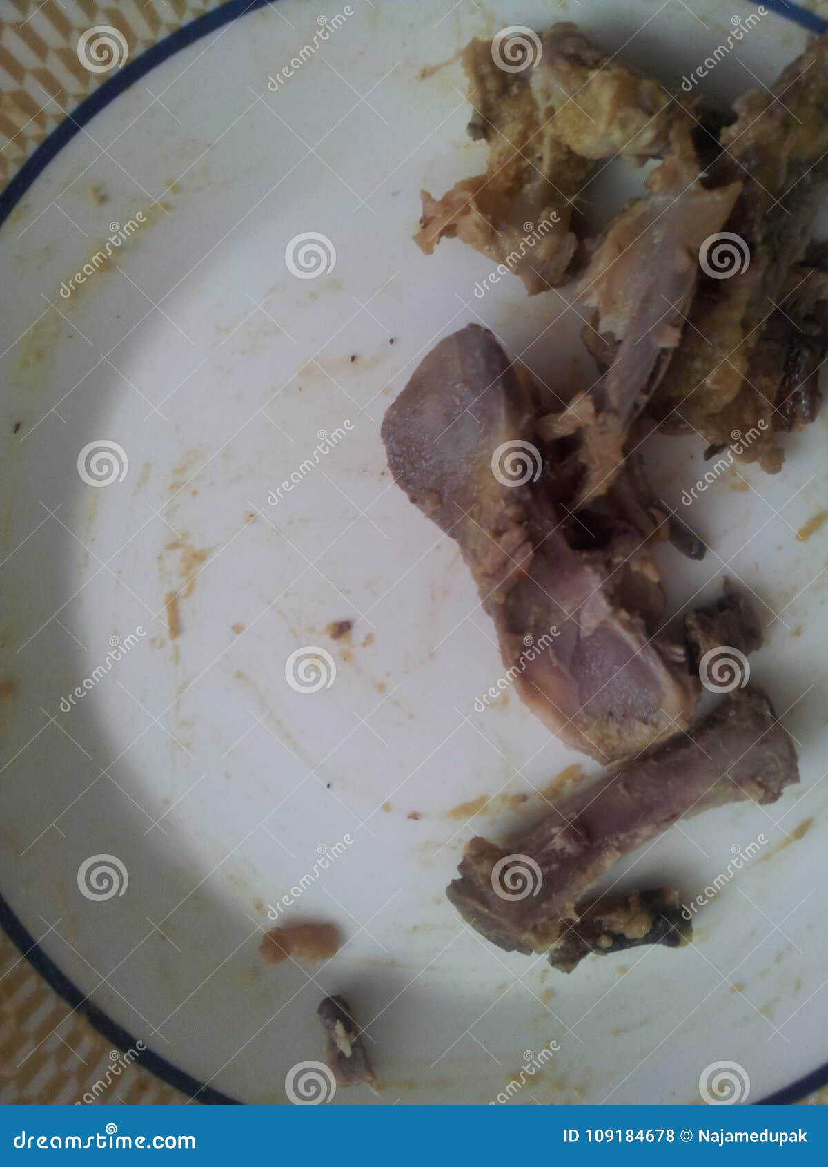 Leftover Chicken Bones in a White Ceramic Plate Stock Photo - Image of ...