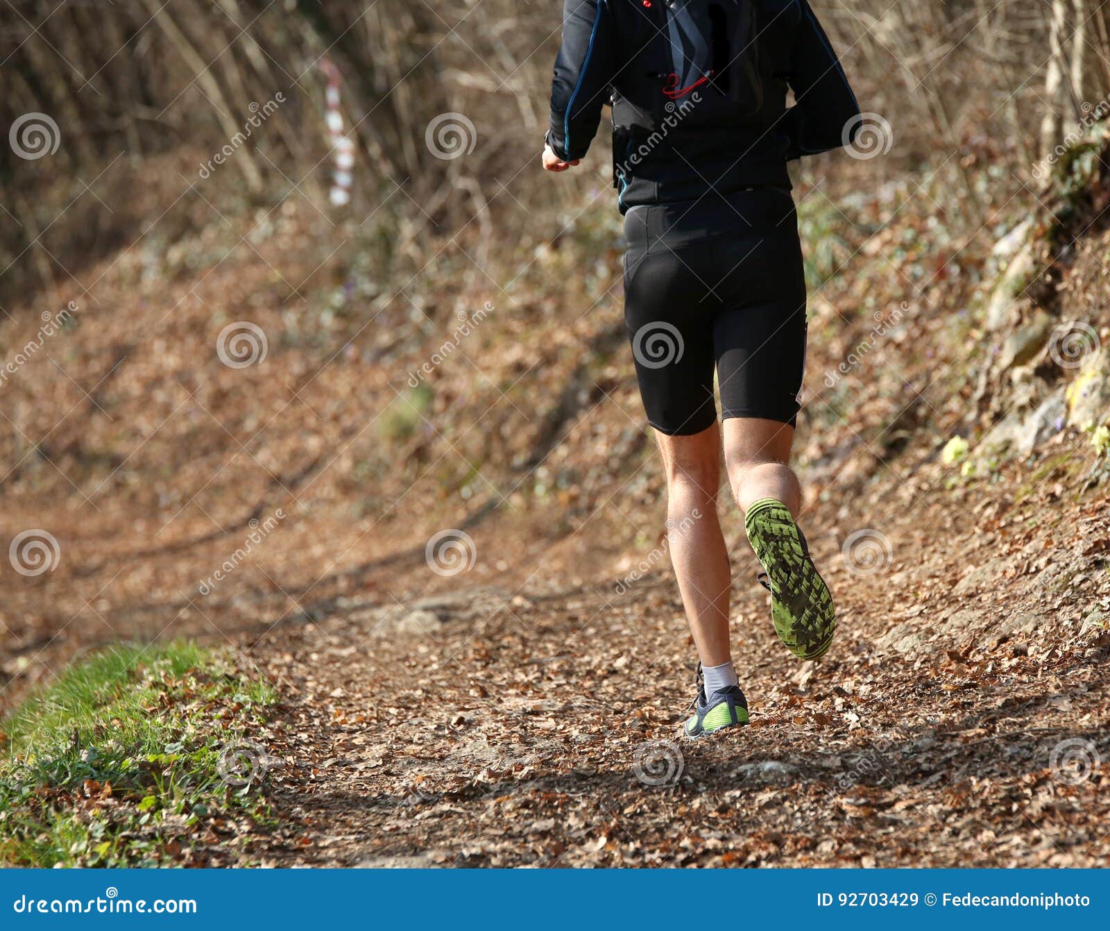 Leg of Athlete Runner from Behind during Racing on the Mountain Stock ...