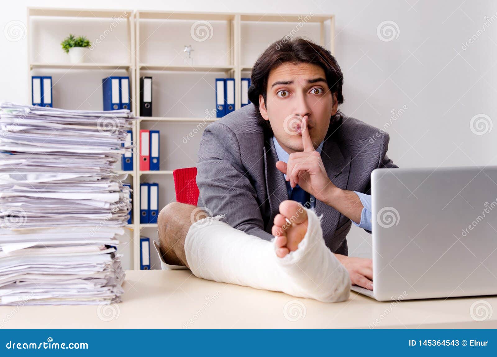 The Leg Injured Employee Working in the Office Stock Image - Image of ...