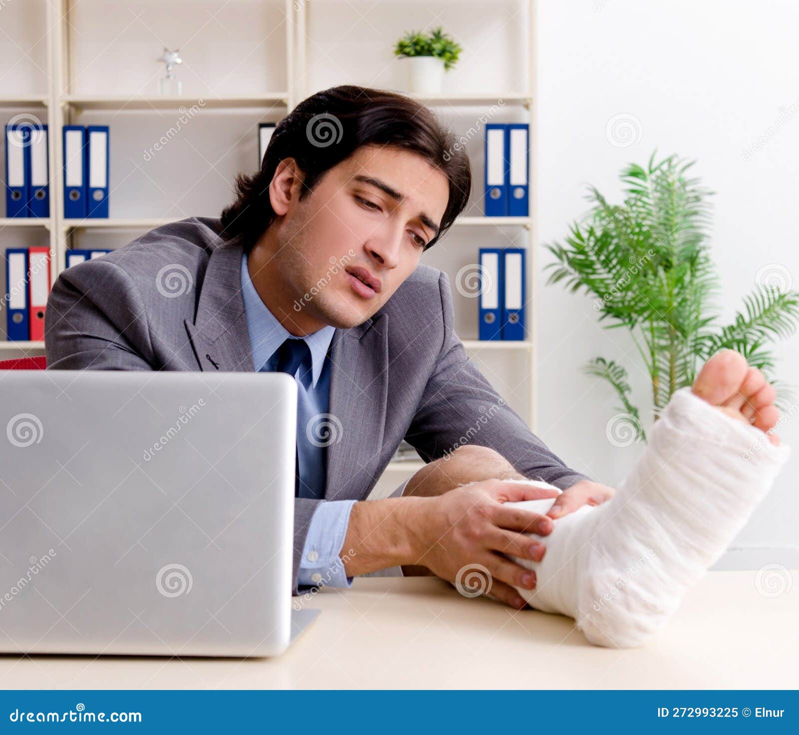Leg Injured Employee Working in the Office Stock Image - Image of ...