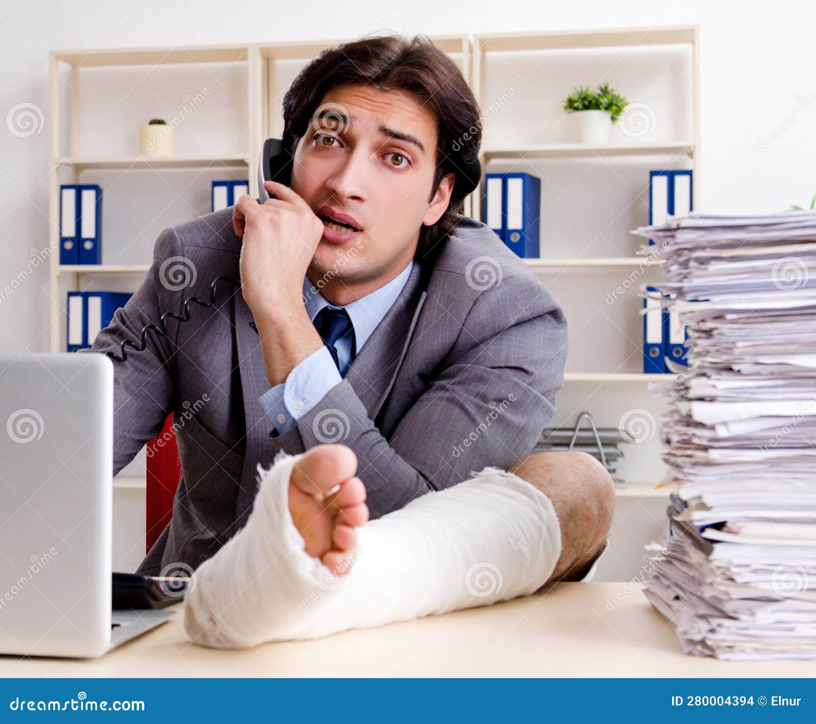 Leg Injured Employee Working in the Office Stock Photo - Image of ...