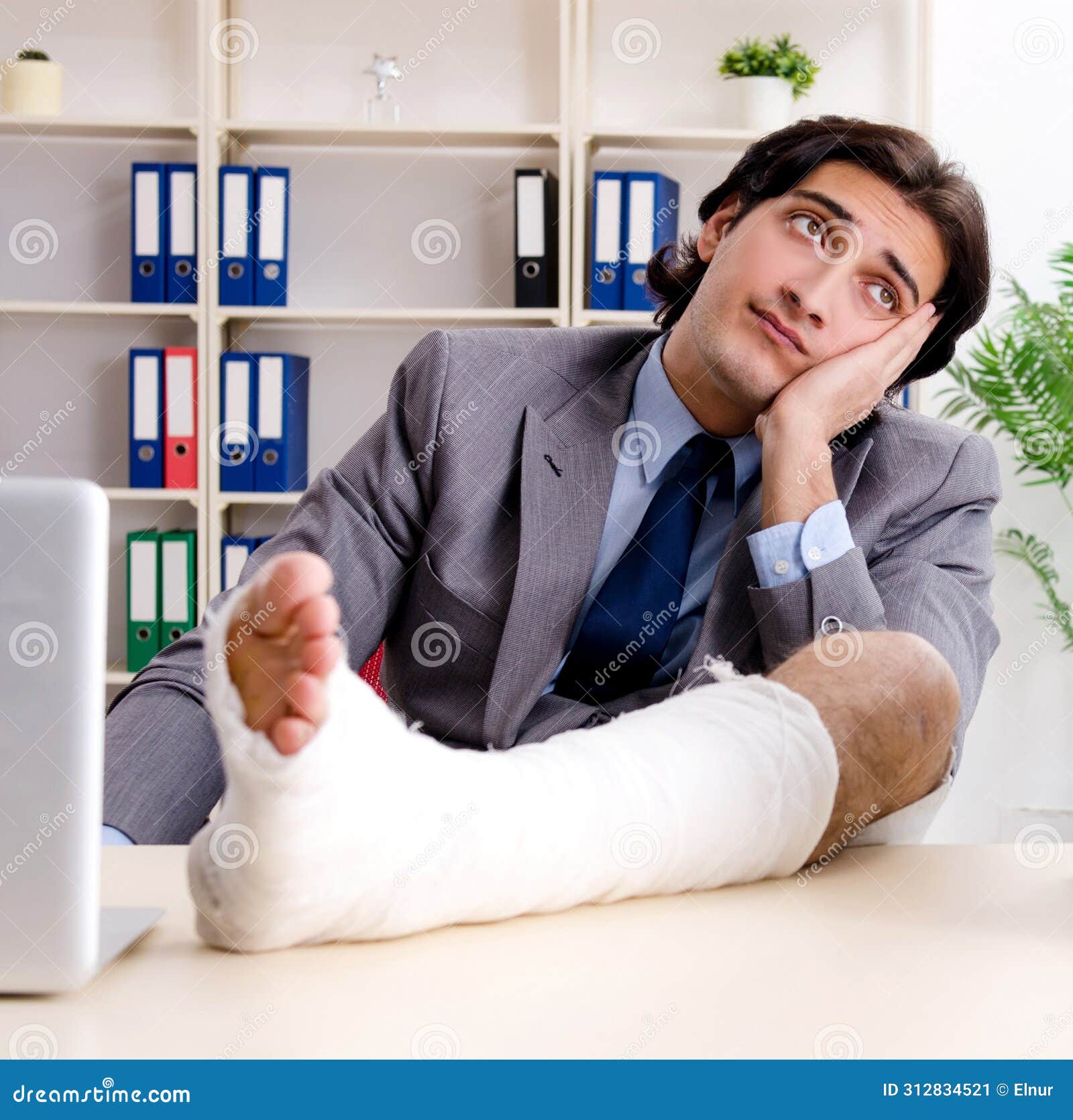 Leg Injured Employee Working in the Office Stock Image - Image of ...