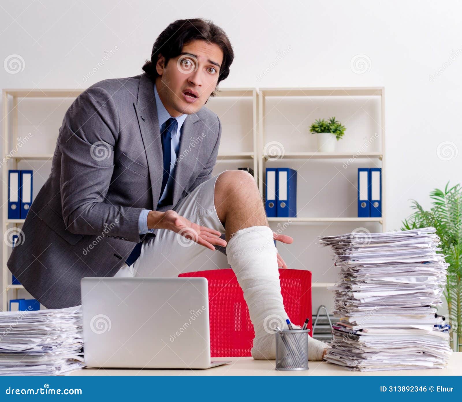 Leg Injured Employee Working in the Office Stock Photo - Image of ...
