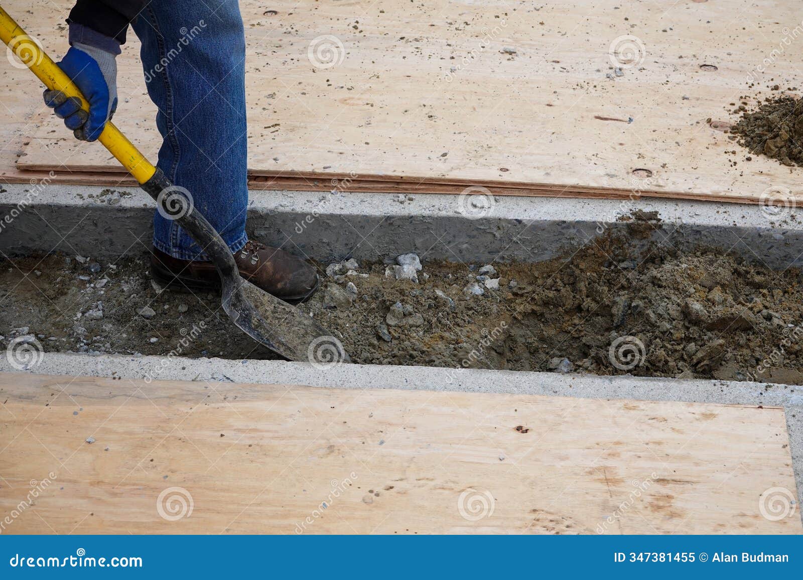 Leg of Laborer with Shovel Digging a Ditch through a Channel between ...