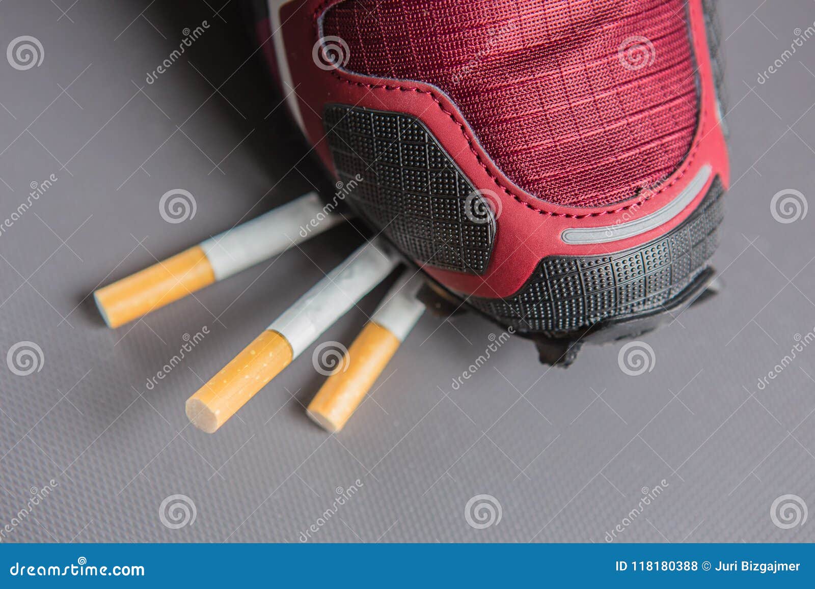 Leg in Sneaker Treads Down Cigarettes. Stock Photo - Image of toxic ...
