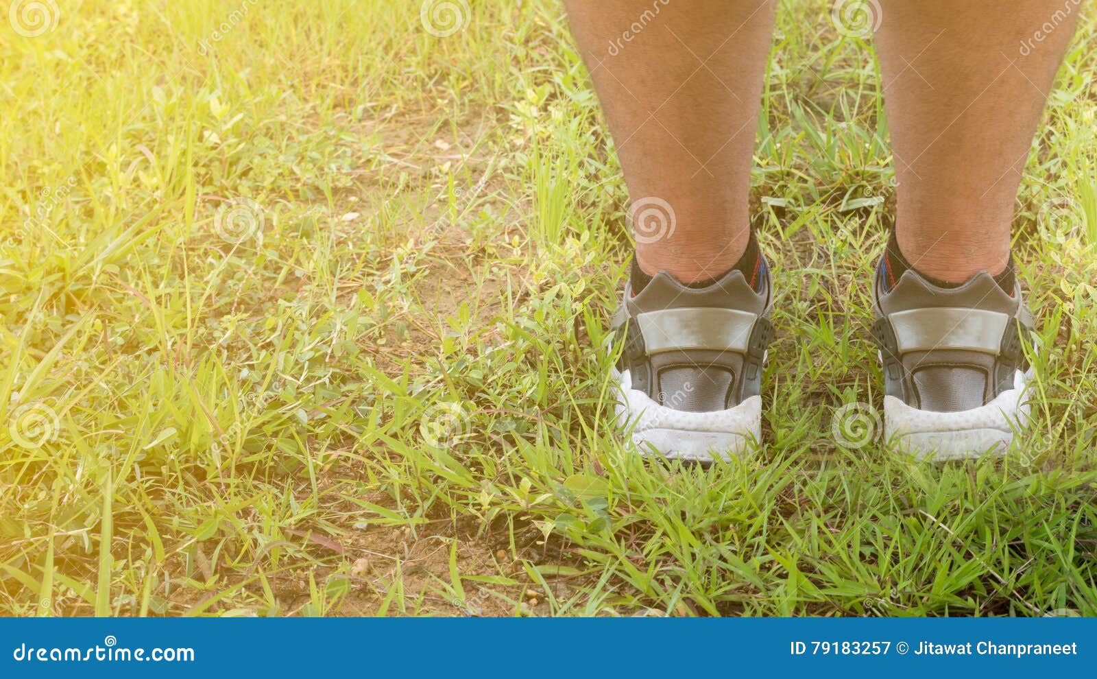 Leg Wuth Running Shoes on Grass Background with Sun Light Stock Image ...