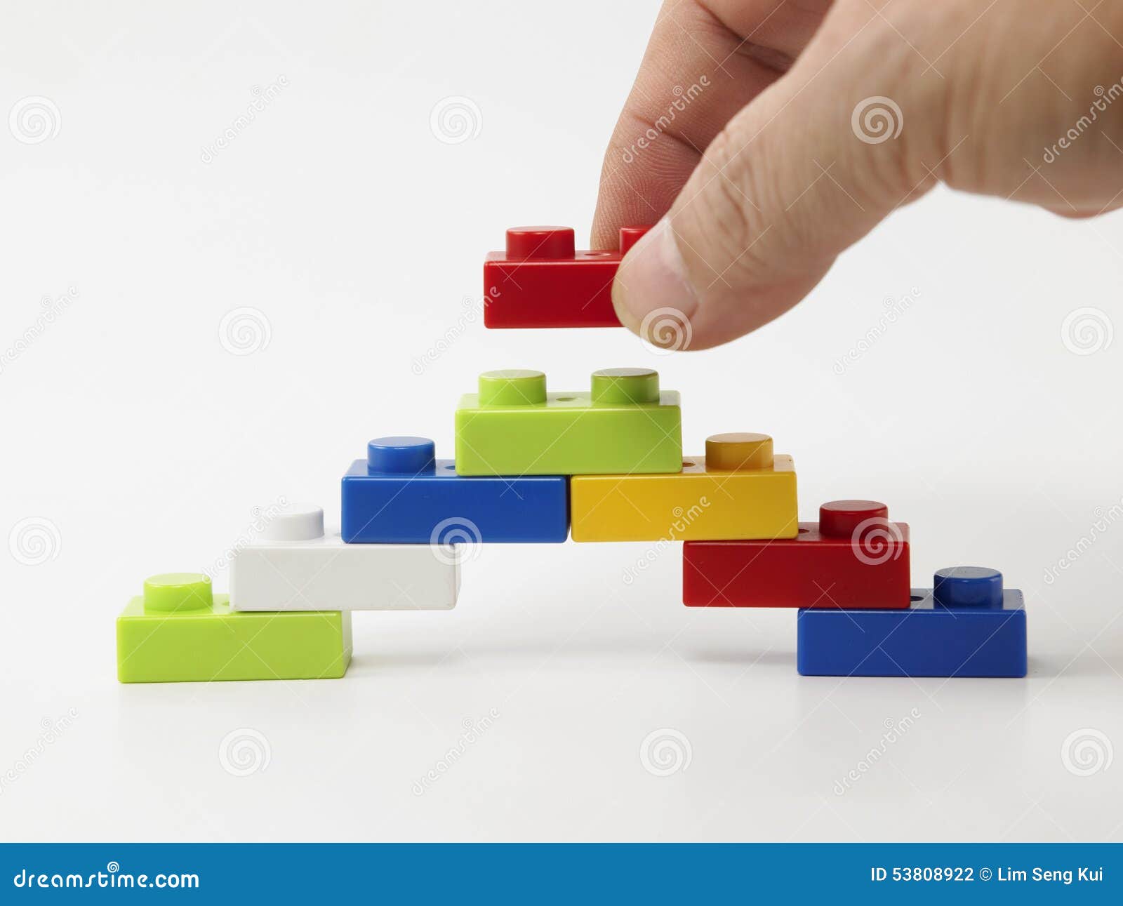 Lego foto de archivo. Imagen de amarillo, mano, juguete - 53808922