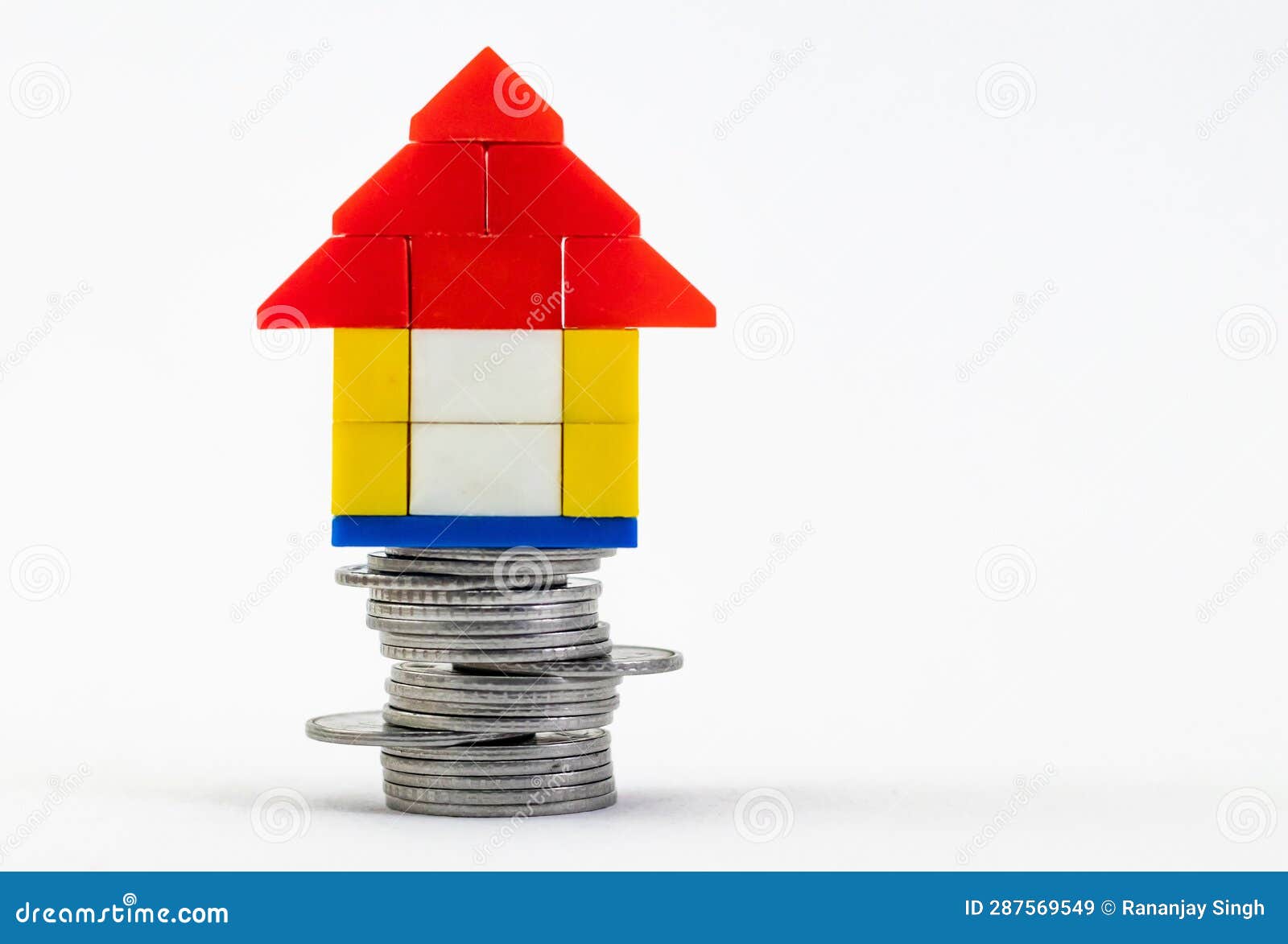 A Lego House and Falling Coins from the Column in Foundation Concept ...
