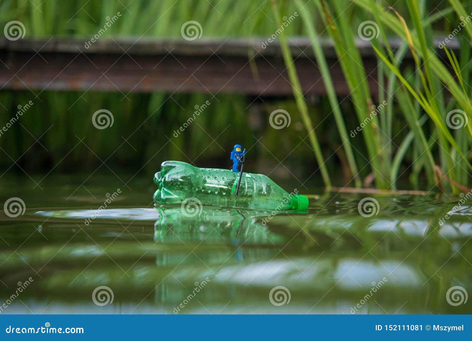 Lego Minifigure Swimming on Plastic Bottle Editorial Photo - Image of ...