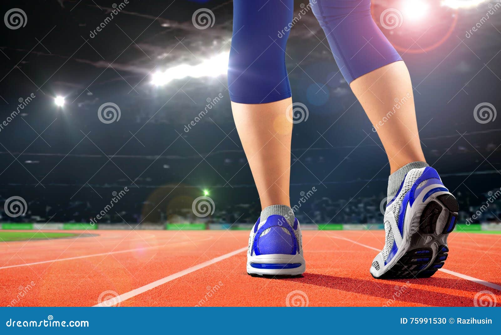 Legs of Athlete on Running Track in the Stadium Stock Photo - Image of ...
