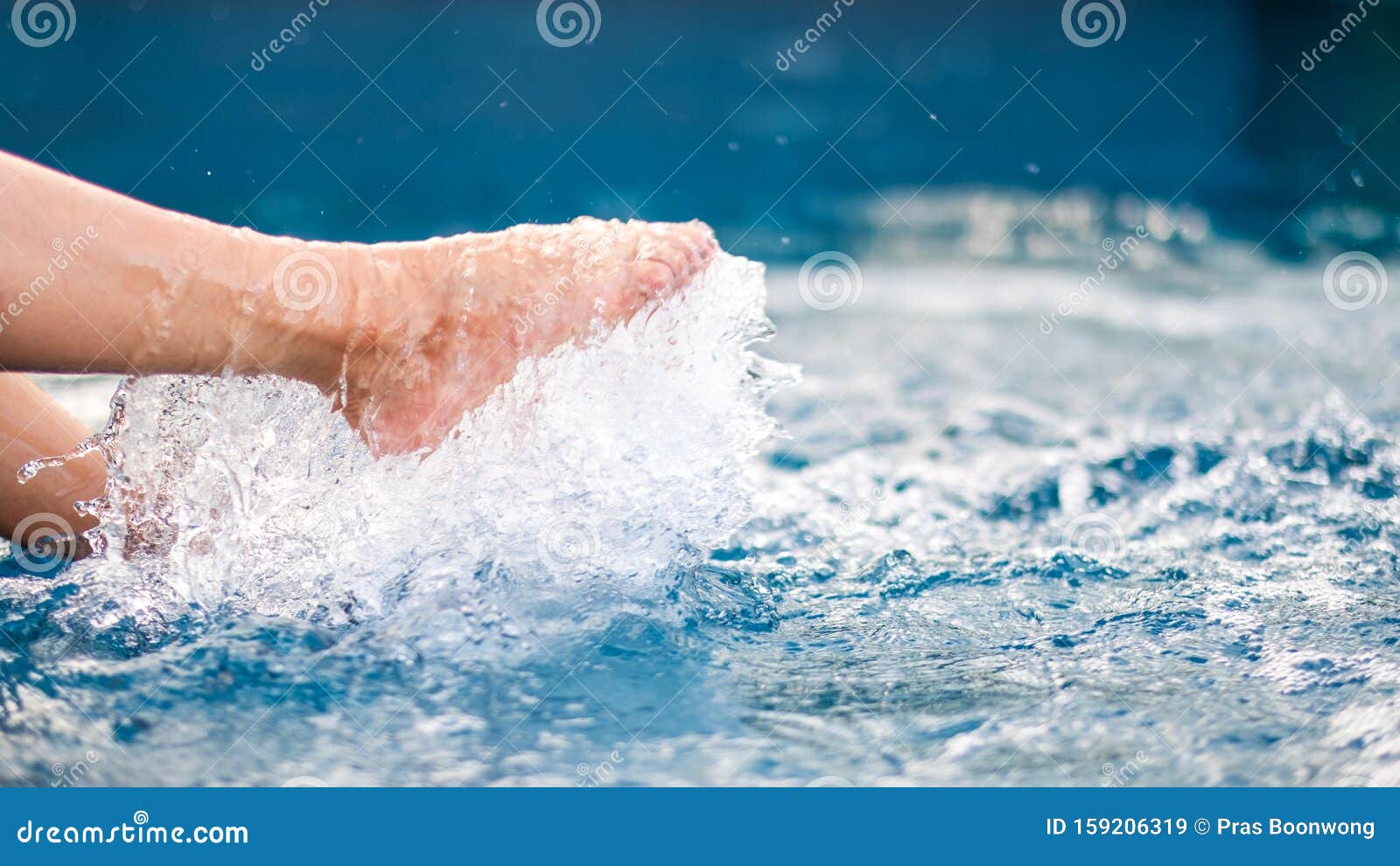Legs and Barefoot Kicking and Splashing Water in the Pool Stock Image ...