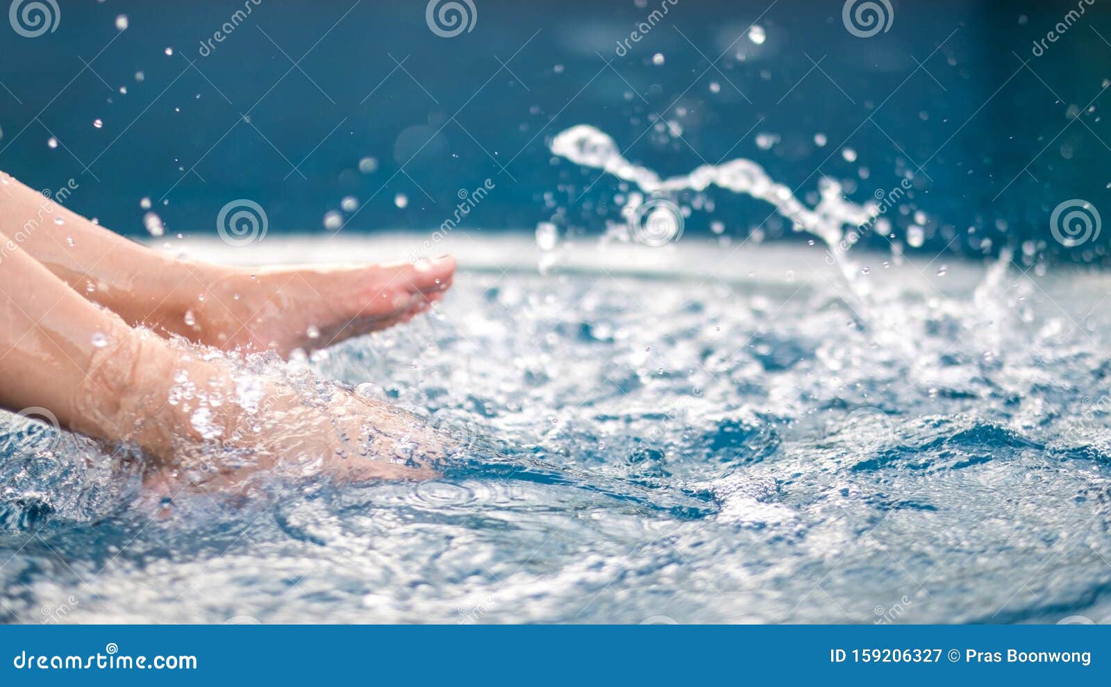 Legs and Barefoot Kicking and Splashing Water in the Pool Stock Image ...