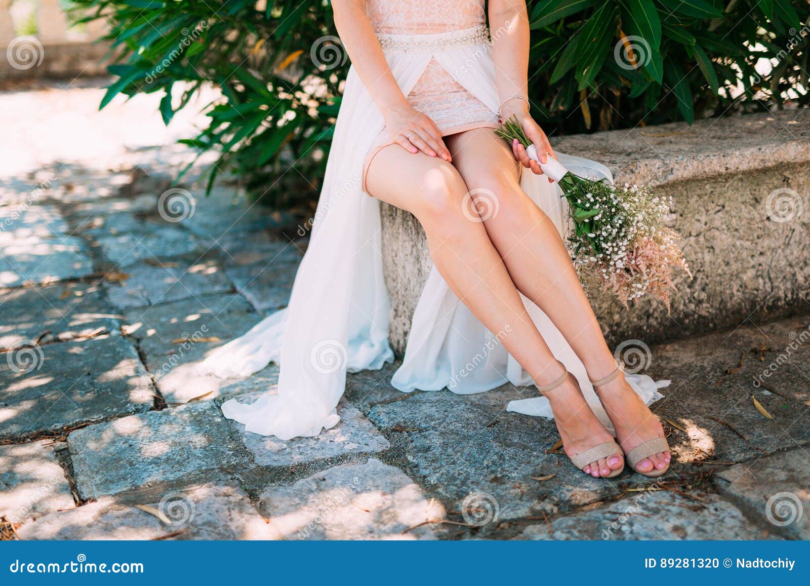 Legs of the Bride and Bouquet Stock Photo - Image of beautiful ...