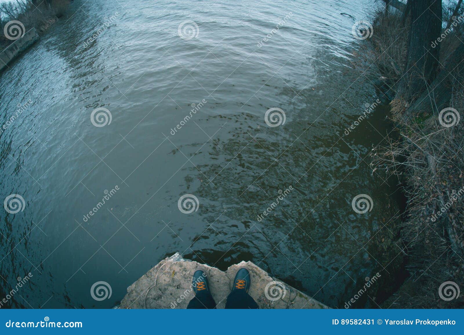Legs on the Edge of a Concrete Dam Near the River Stock Image - Image ...