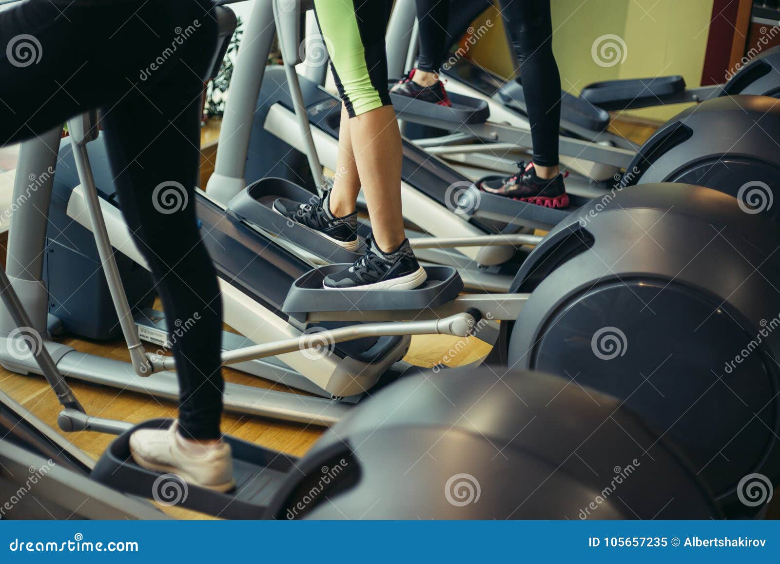 Legs on elliptical trainer stock image. Image of exercise - 105657235