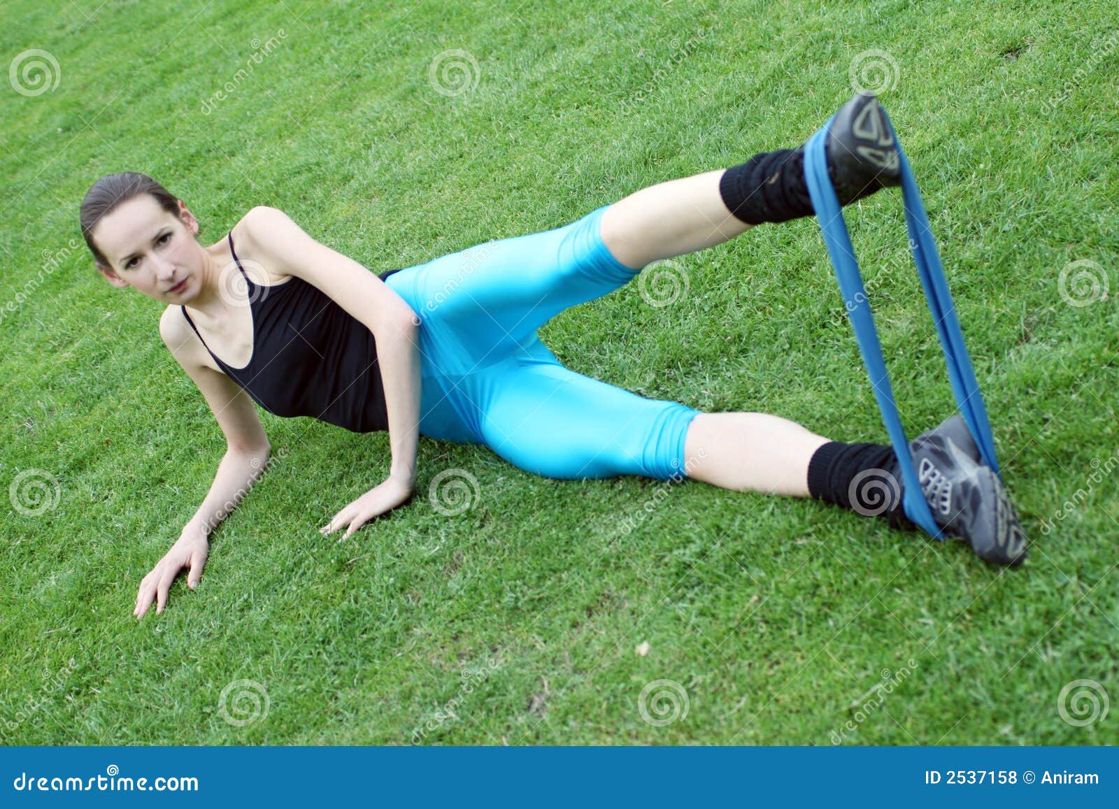 Legs exercise with a band stock photo. Image of female - 2537158