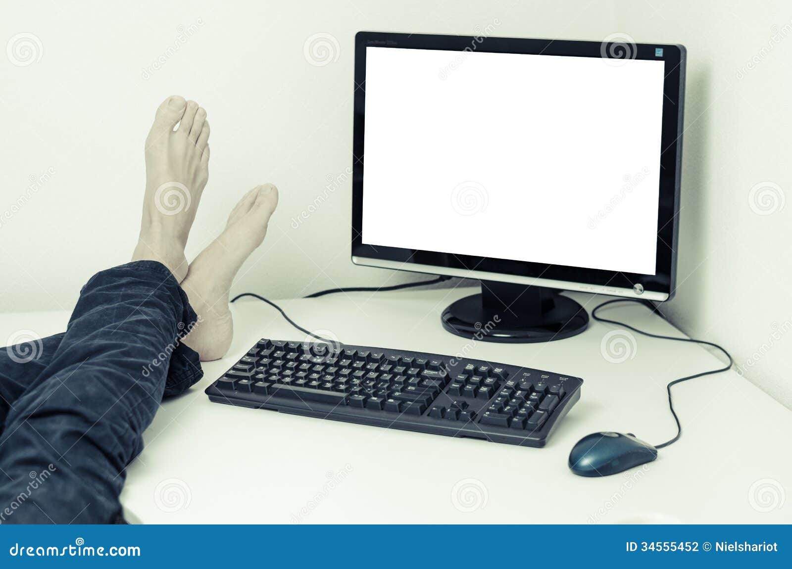 Legs and Feet without Shoes on Desk with White Screen Stock Photo ...