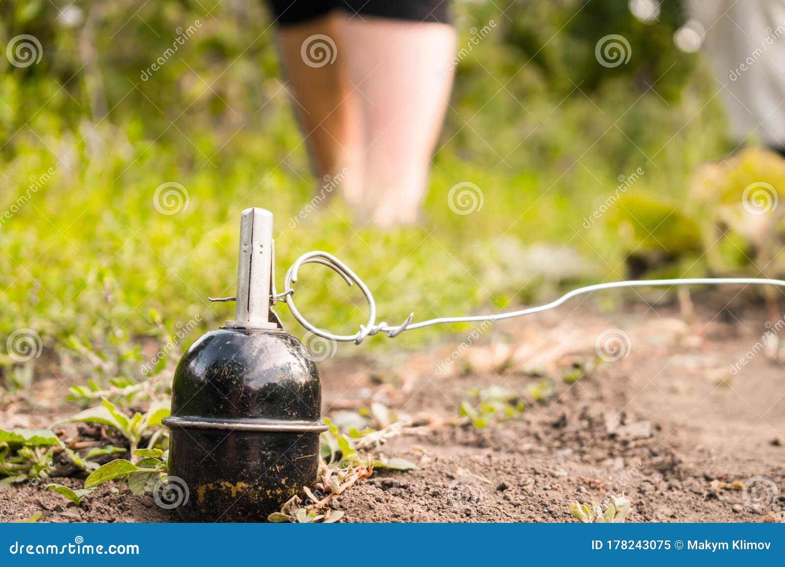 The Legs are in Front of the Mine. a Grenade Trap is on the Ground ...