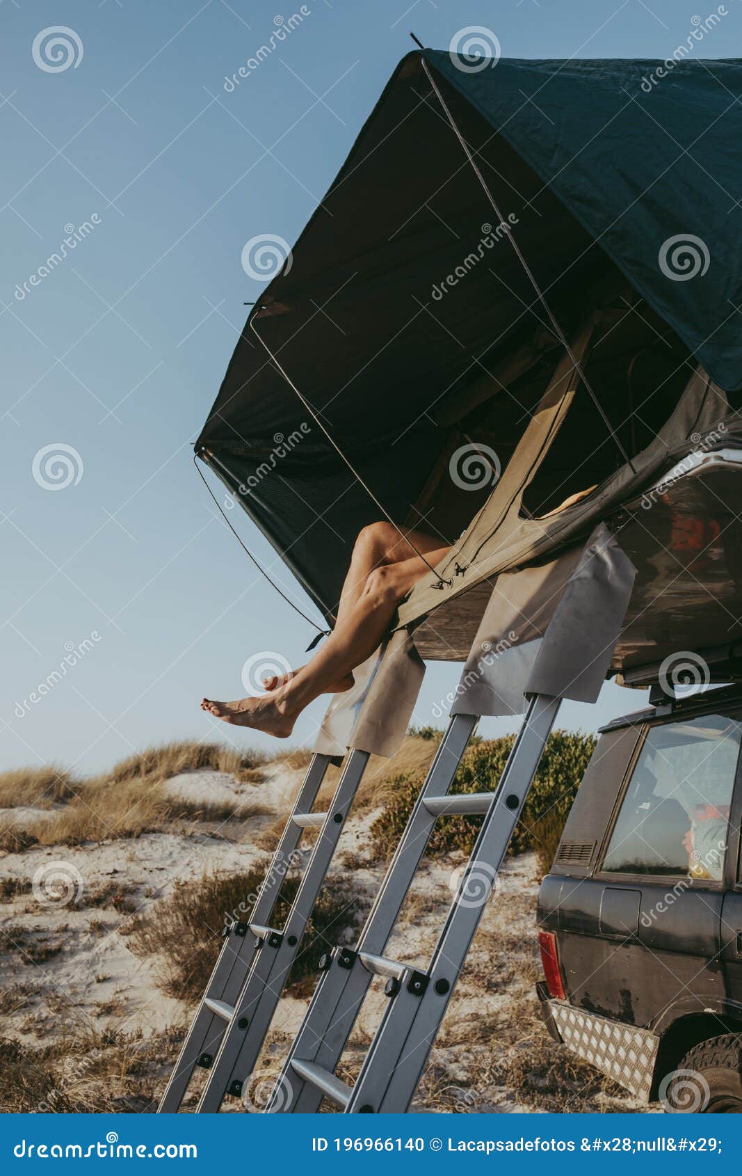 Legs Inside a Rooftent on Top of a 4x4 Car Stock Photo - Image of ...