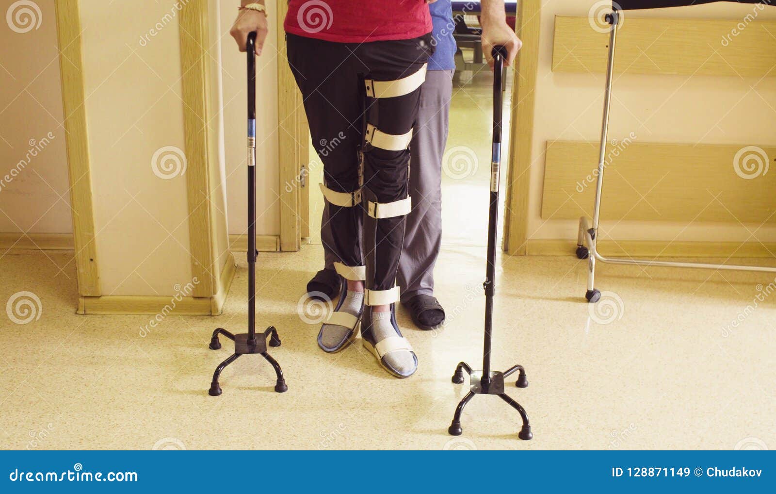 Legs of Invalid in Orthosis Walking with Support of Two Walking Cane ...