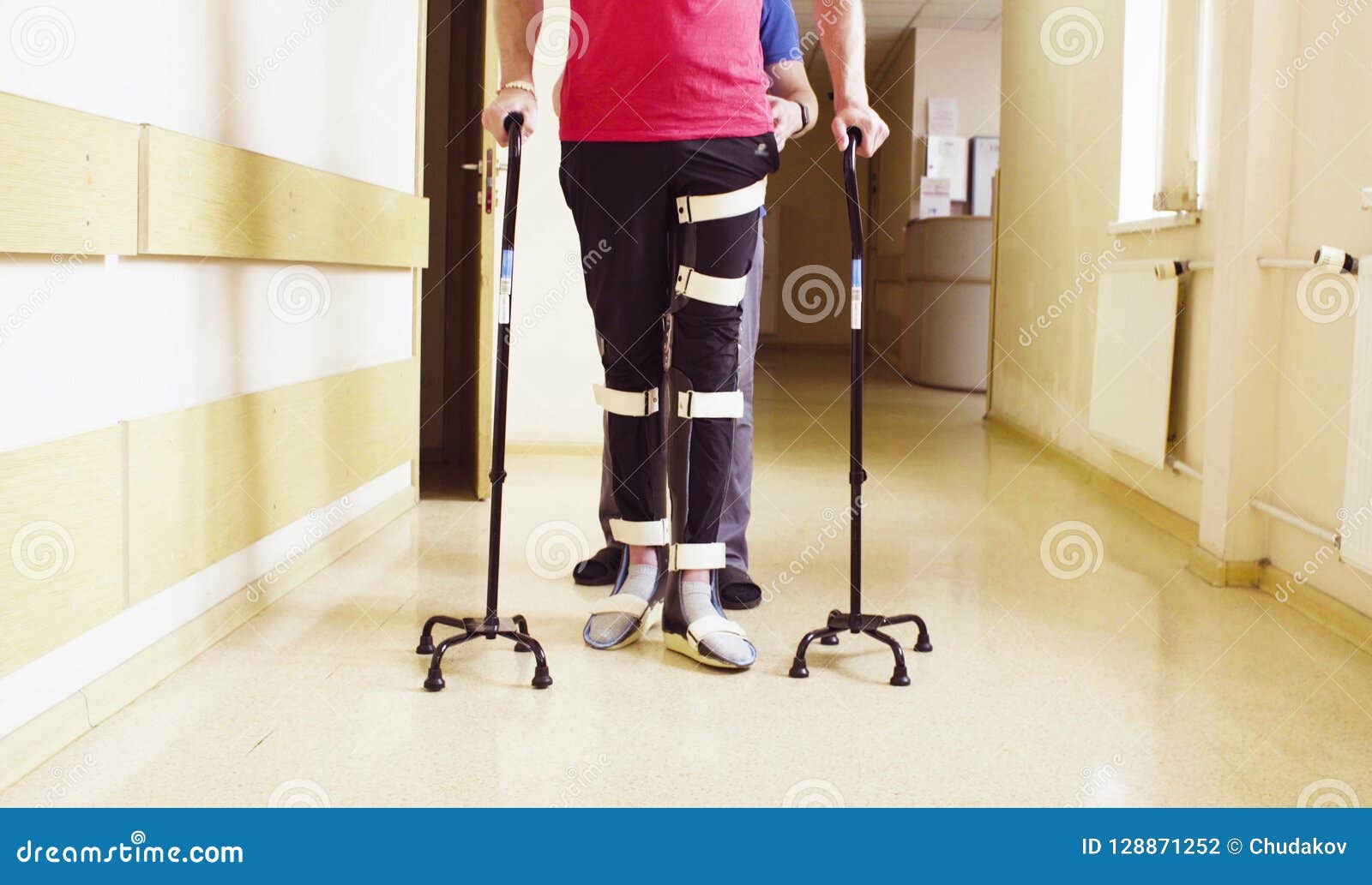 Legs of Invalid in Orthosis Walking with Support of Two Walking Cane ...