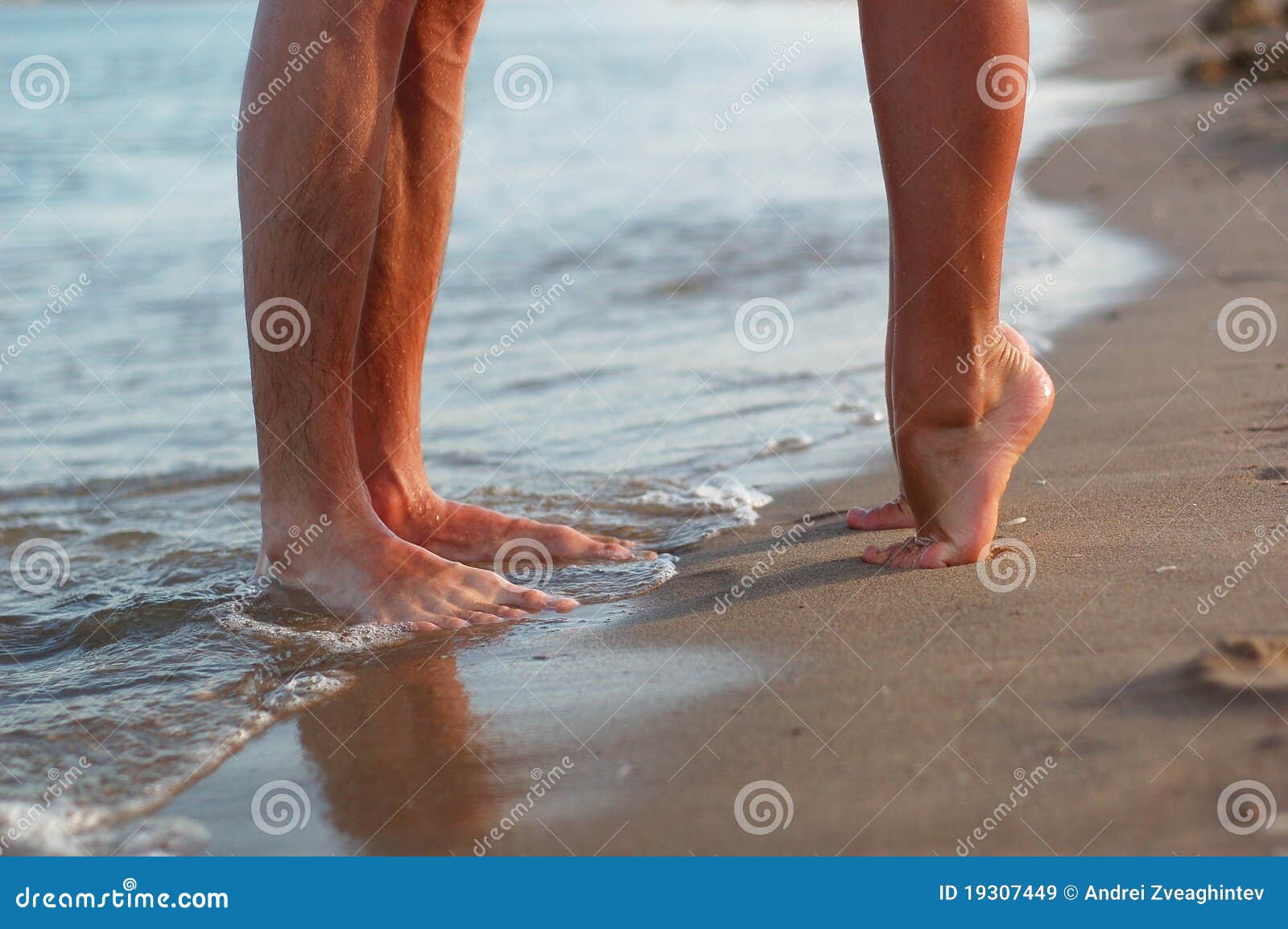 Legs of kissing couple stock image. Image of beach, legs - 19307449