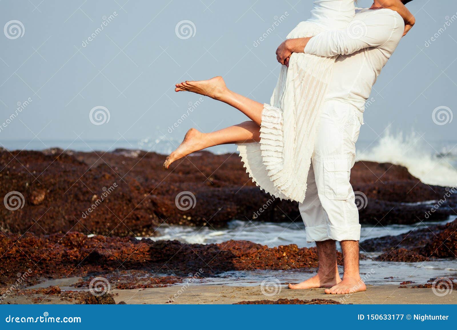 Legs of a Loving Couple Hugging on the Beach Stock Image - Image of ...