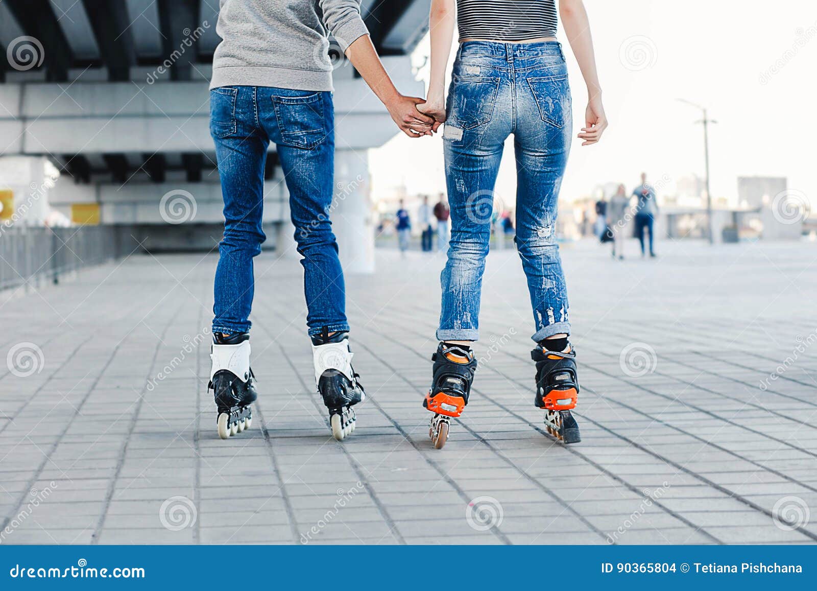 Legs Loving Couple in Jeans and Rollerblading. Ride on the Rolle Stock ...