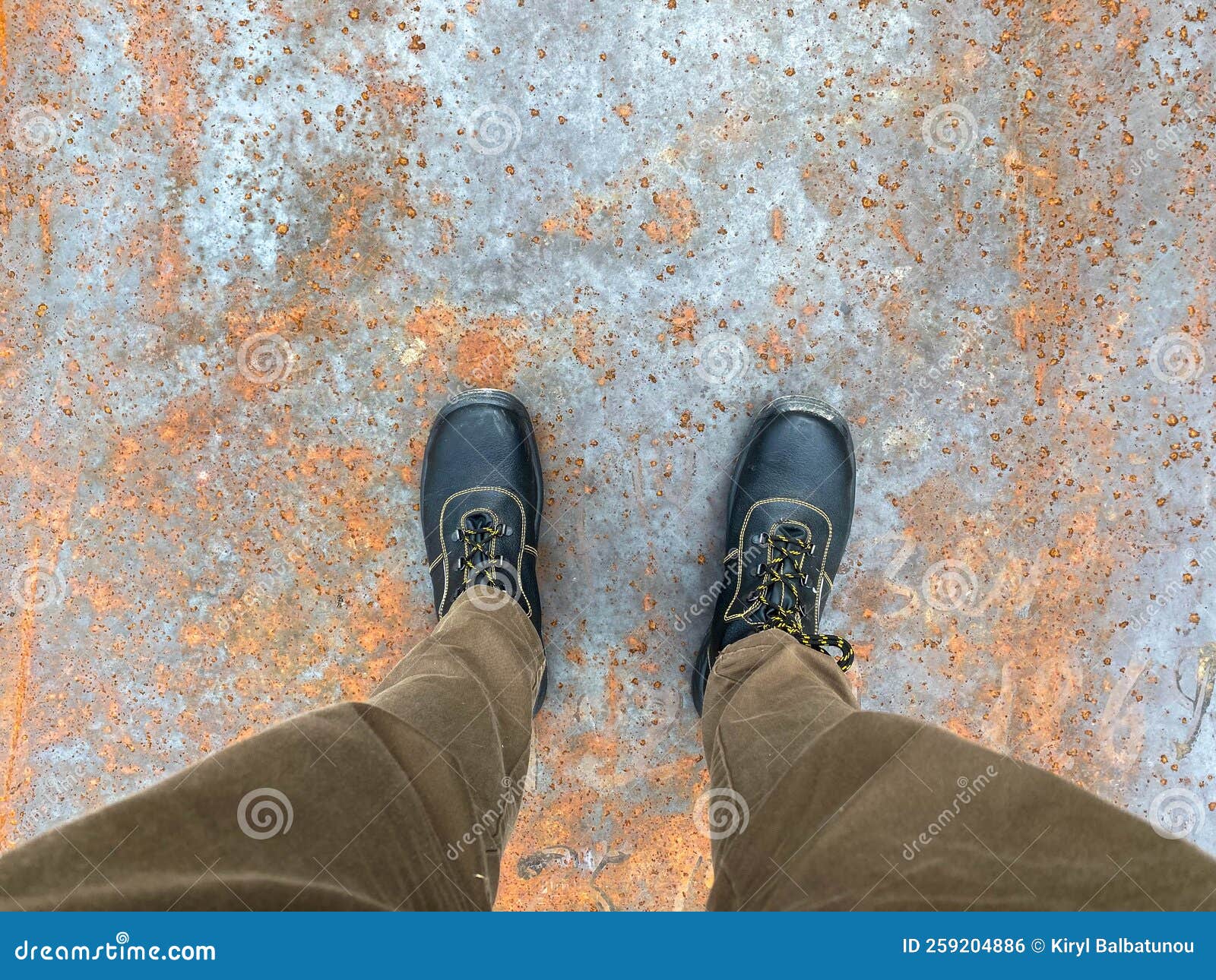 Legs of a Man in Boots on the Background of a Rusty Old Iron Red ...