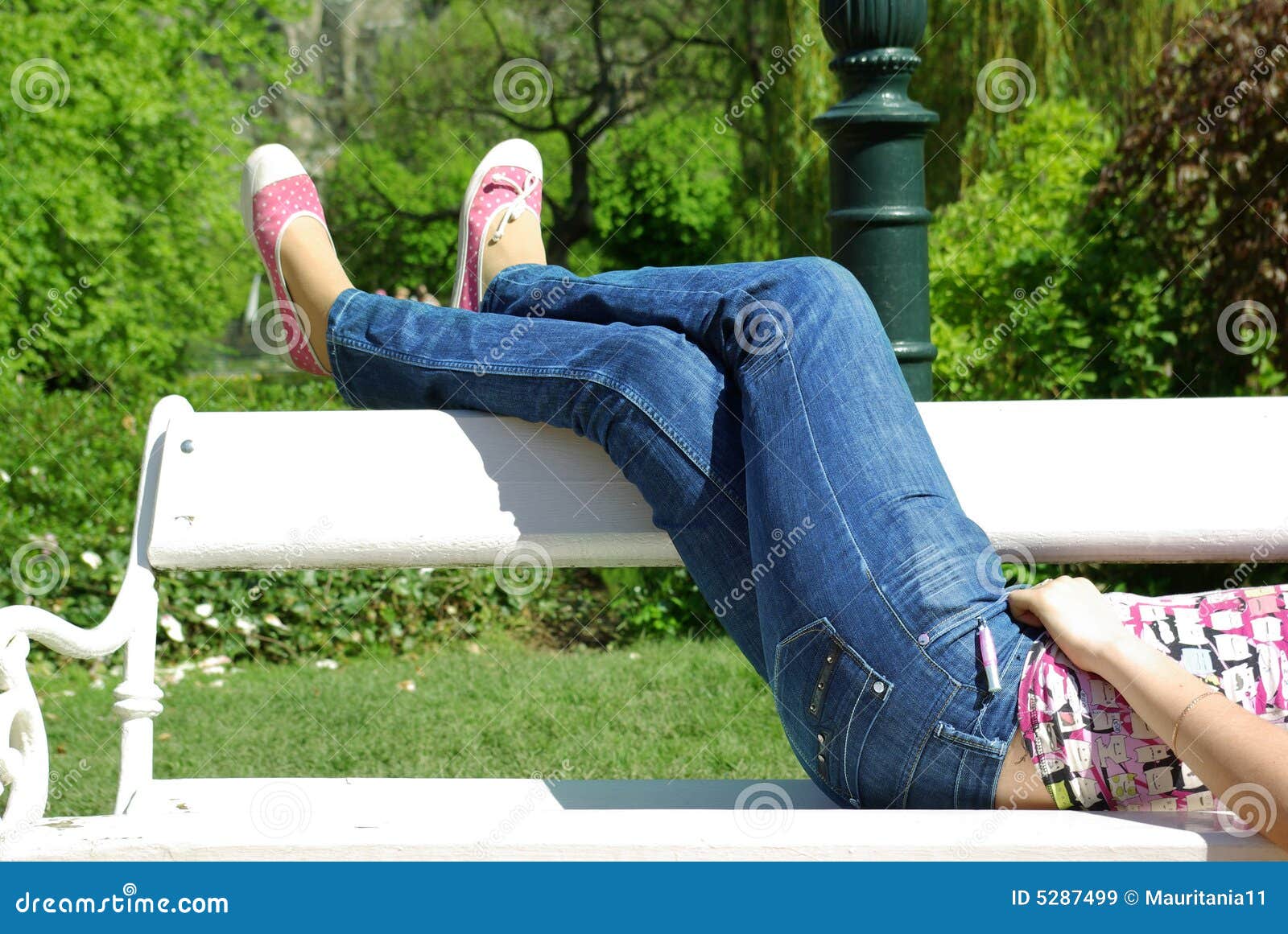 Legs of Person Relaxing on Bench Stock Image - Image of pink ...