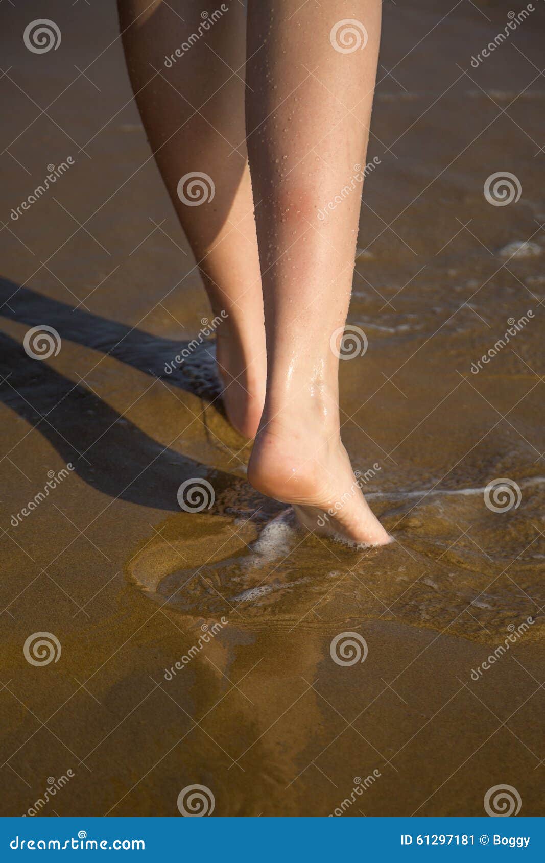 Legs in the sea stock image. Image of young, sand, lady - 61297181