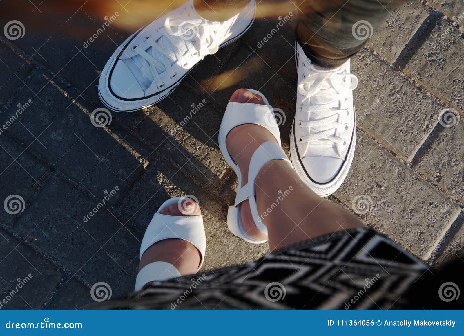 Legs on a sidewalk tile stock photo. Image of legs, tile - 111364056