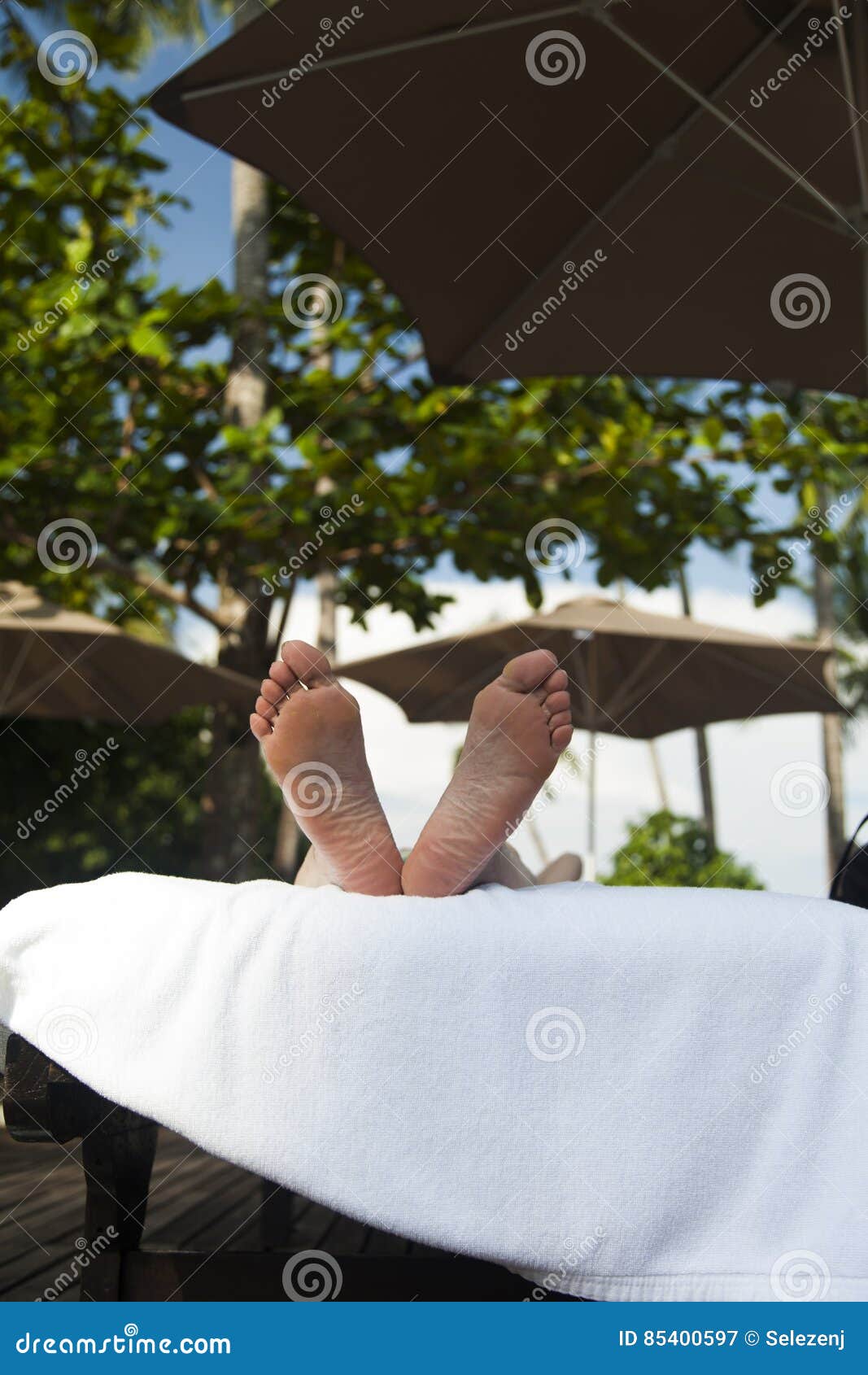 Legs of the Sunbathing Person Stock Image - Image of blue, body: 85400597