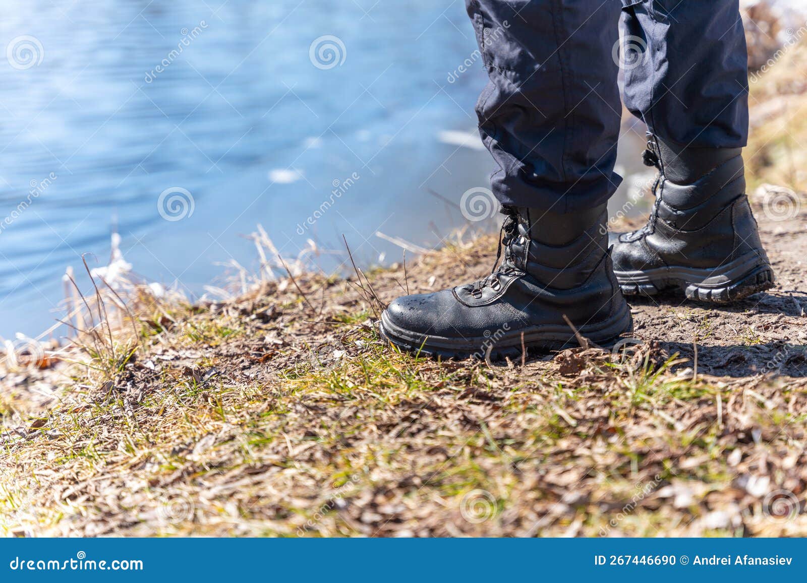 Legs of a Tourist in Boots on the River Bank Stock Photo - Image of ...