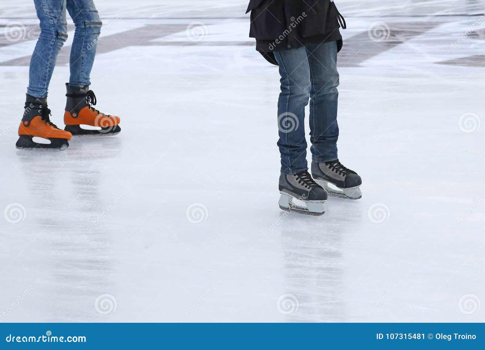 Legs of Two People Skating on the Ice Rink Stock Image - Image of cold ...